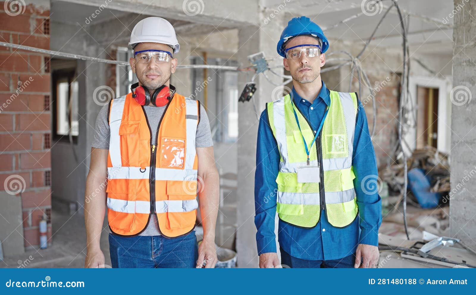 Two Men Builders Standing Together with Relaxed Expression at ...