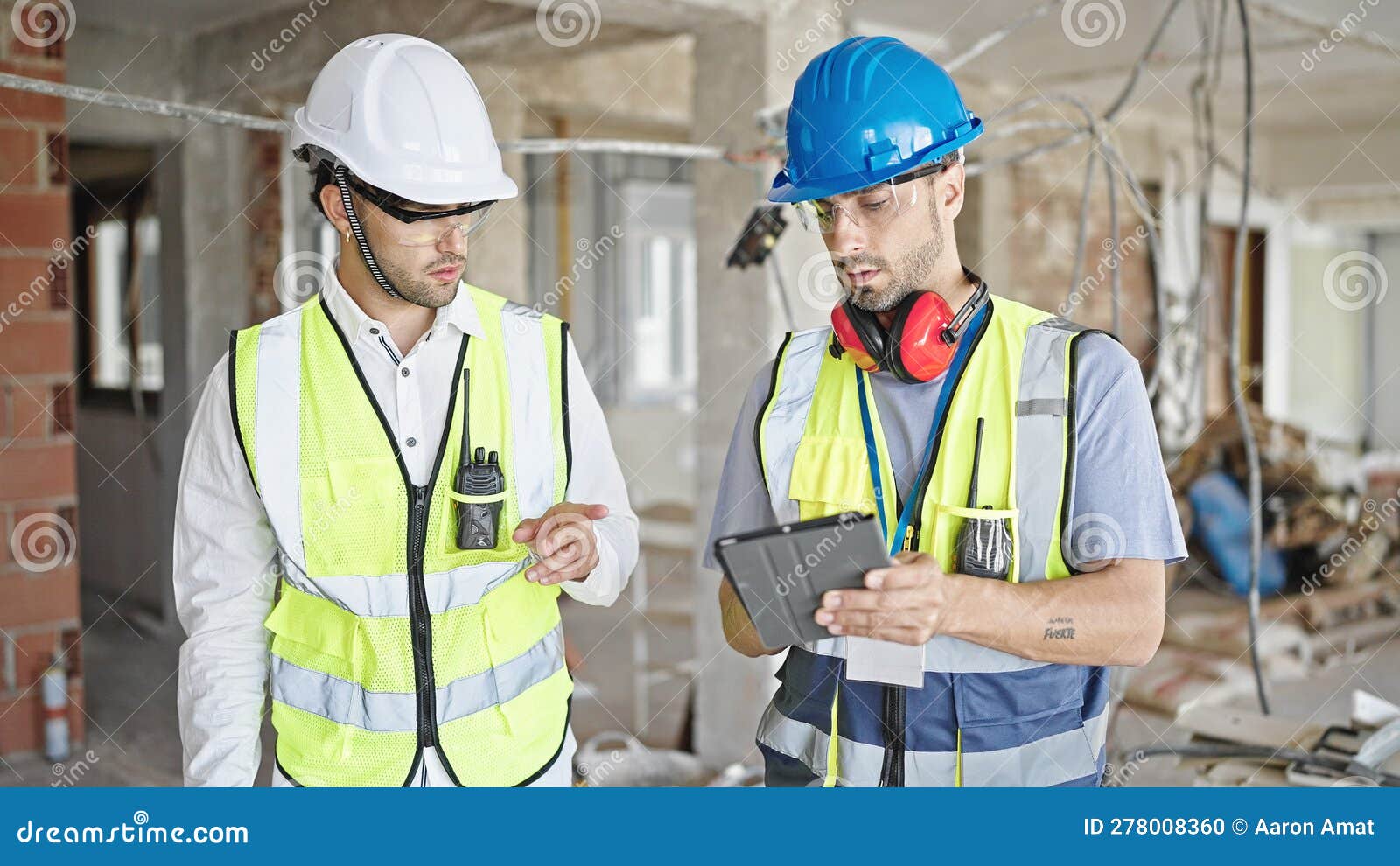 Two Men Builders Using Touchpad at Construction Site Stock Photo ...