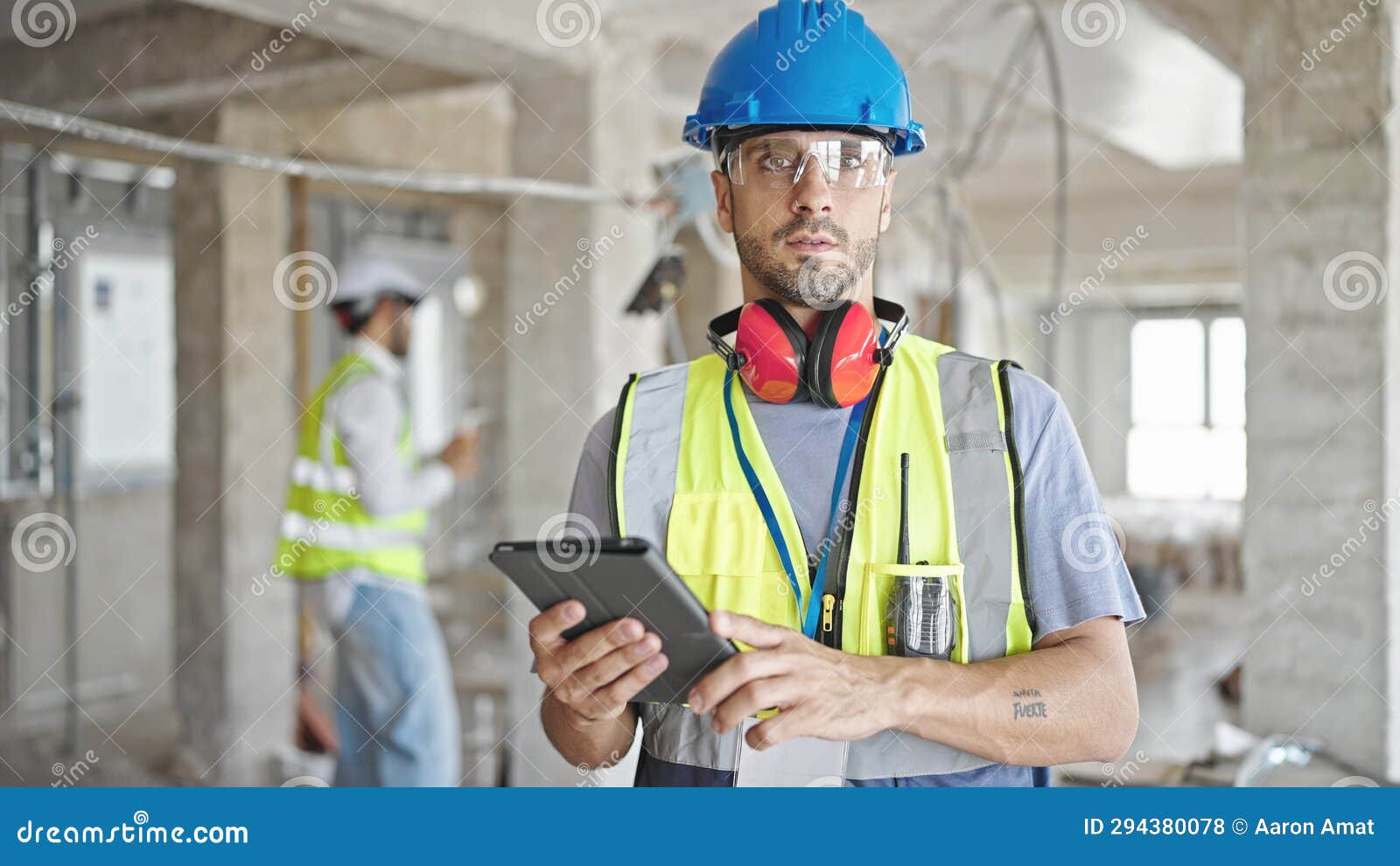 Two Men Builders Using Touchpad at Construction Site Stock Photo ...