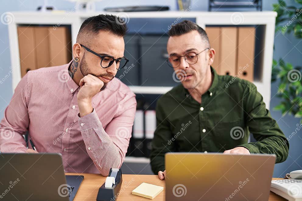 Two Men Business Workers Using Laptop Working at Office Stock Photo ...