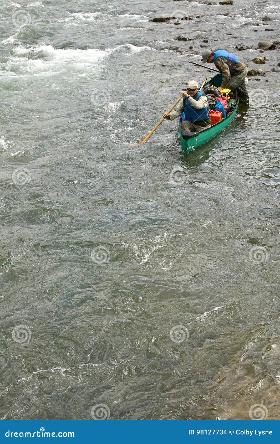 Two Men in a Canoe Navigating Wild River Rapids Editorial Stock Image ...