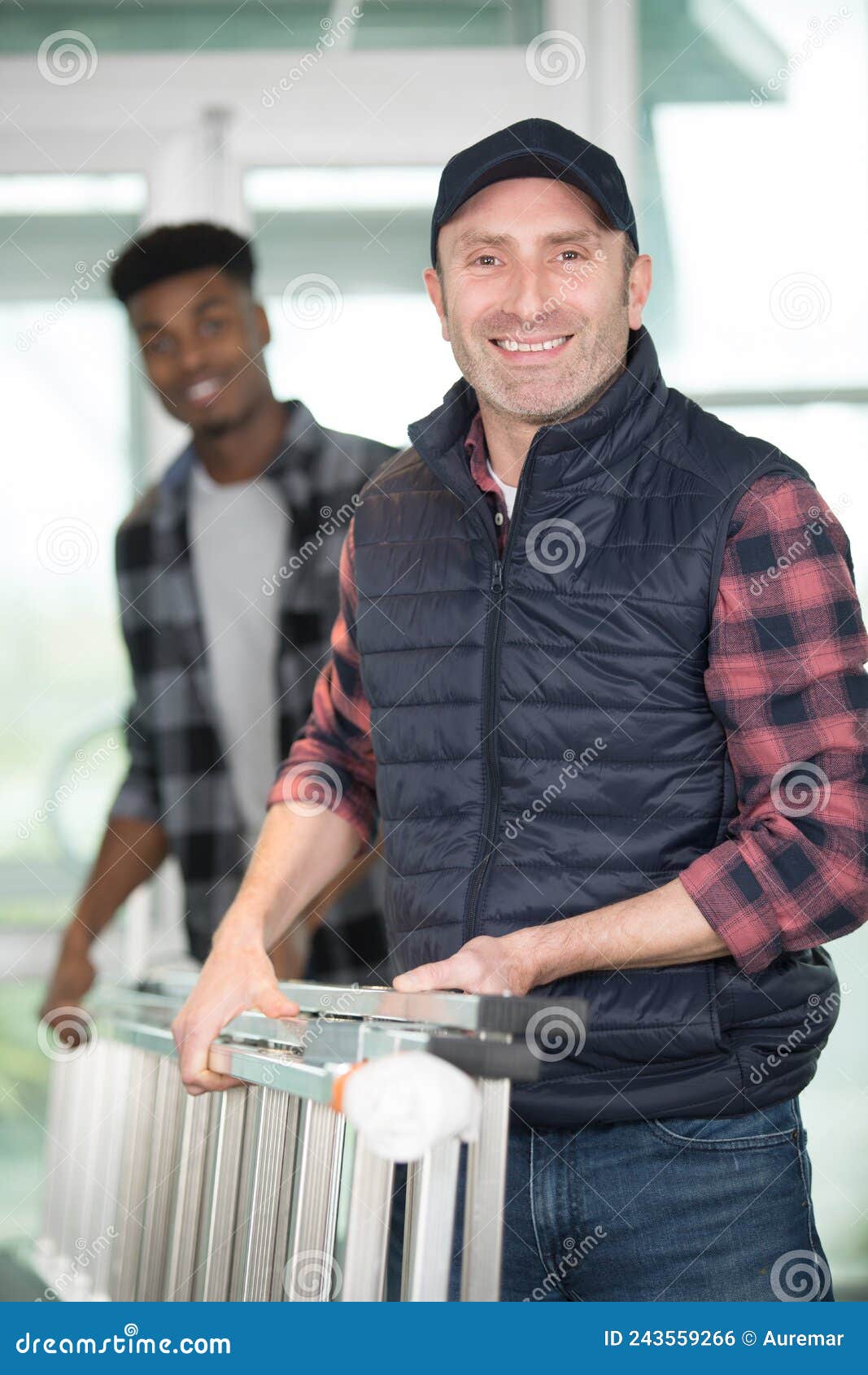 Two men carrying ladder stock photo. Image of caucasian - 243559266