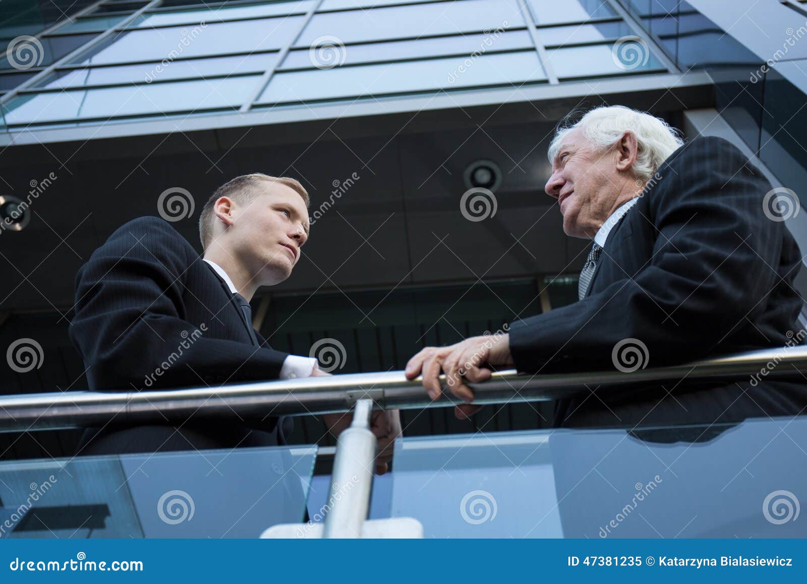 Two men conversing outside stock image. Image of architect - 47381235