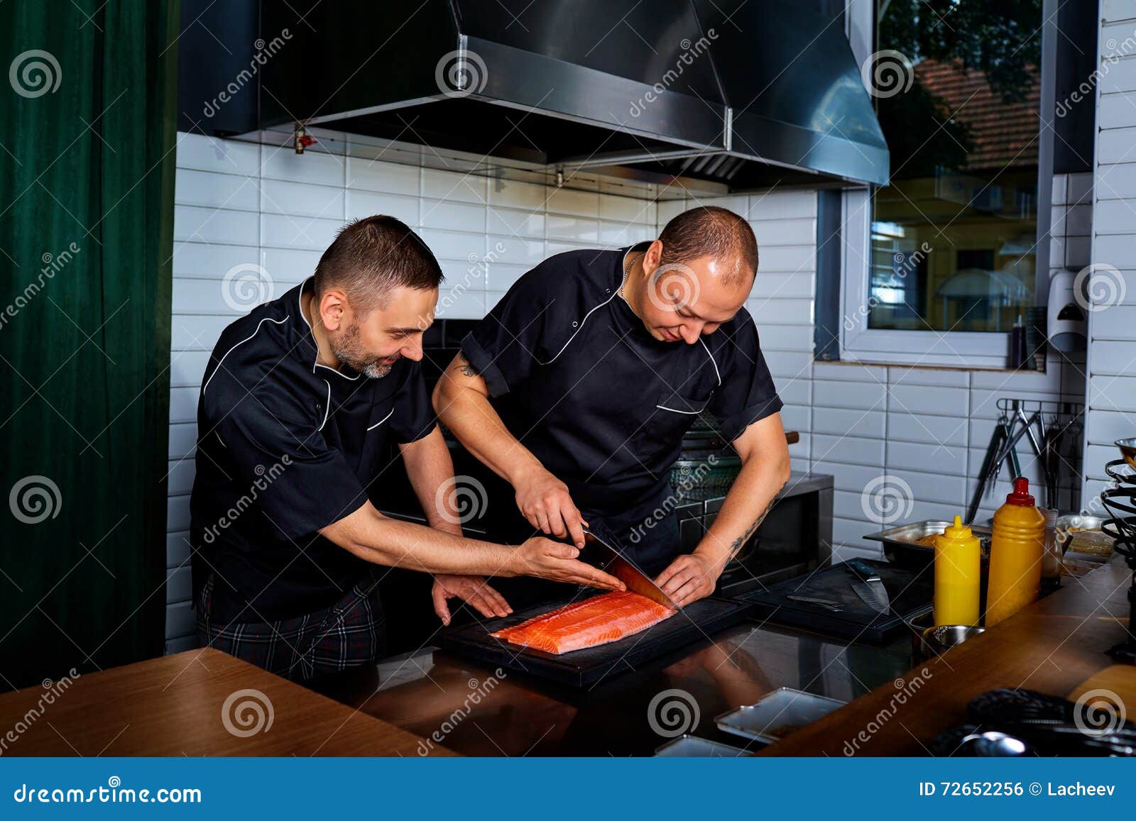 Two Men Cook Chef Cut Up, Cooked Fish in Restaurant Commercial K Stock ...