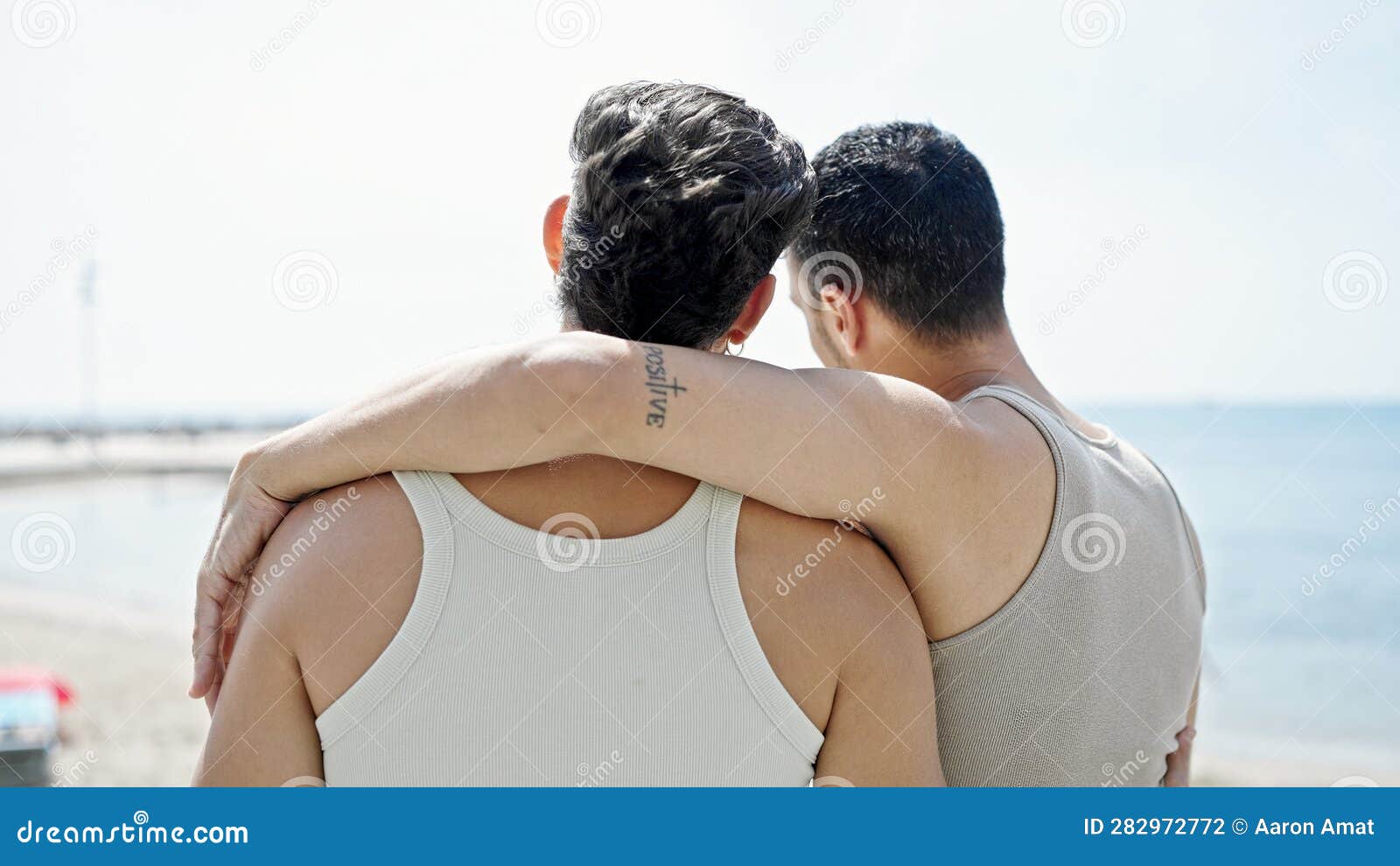 Two Men Couple Hugging Each Other Backwards at Seaside Stock Photo ...