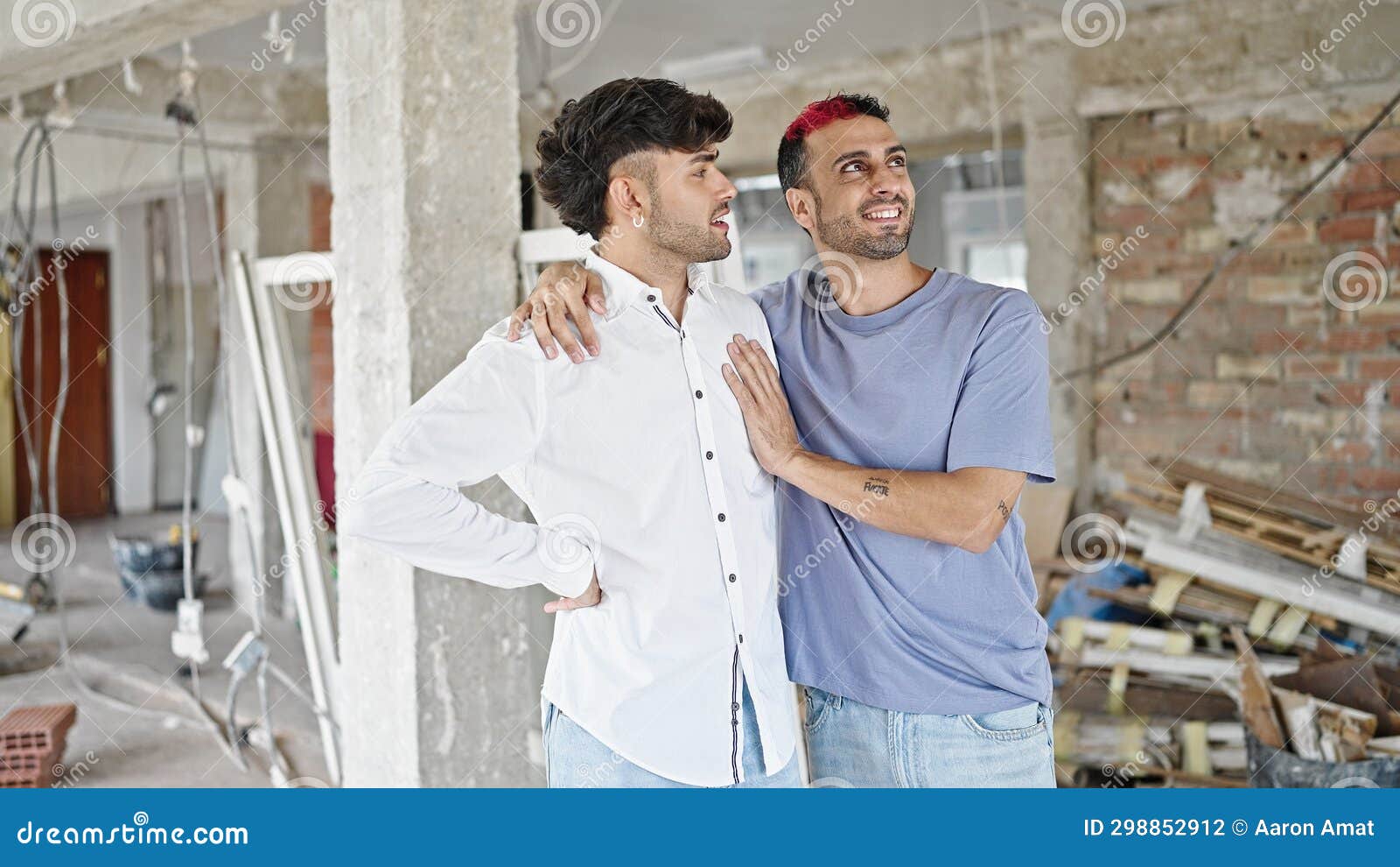 Two Men Couple Hugging Each Other Looking Around at Construction Site ...