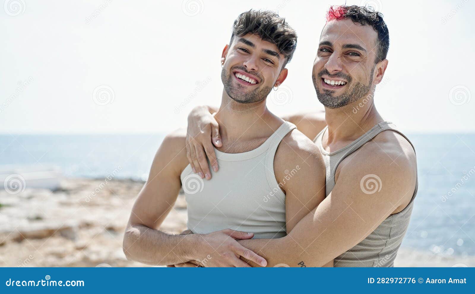 Two Men Couple Smiling Confident Hugging Each Other at Seaside Stock ...