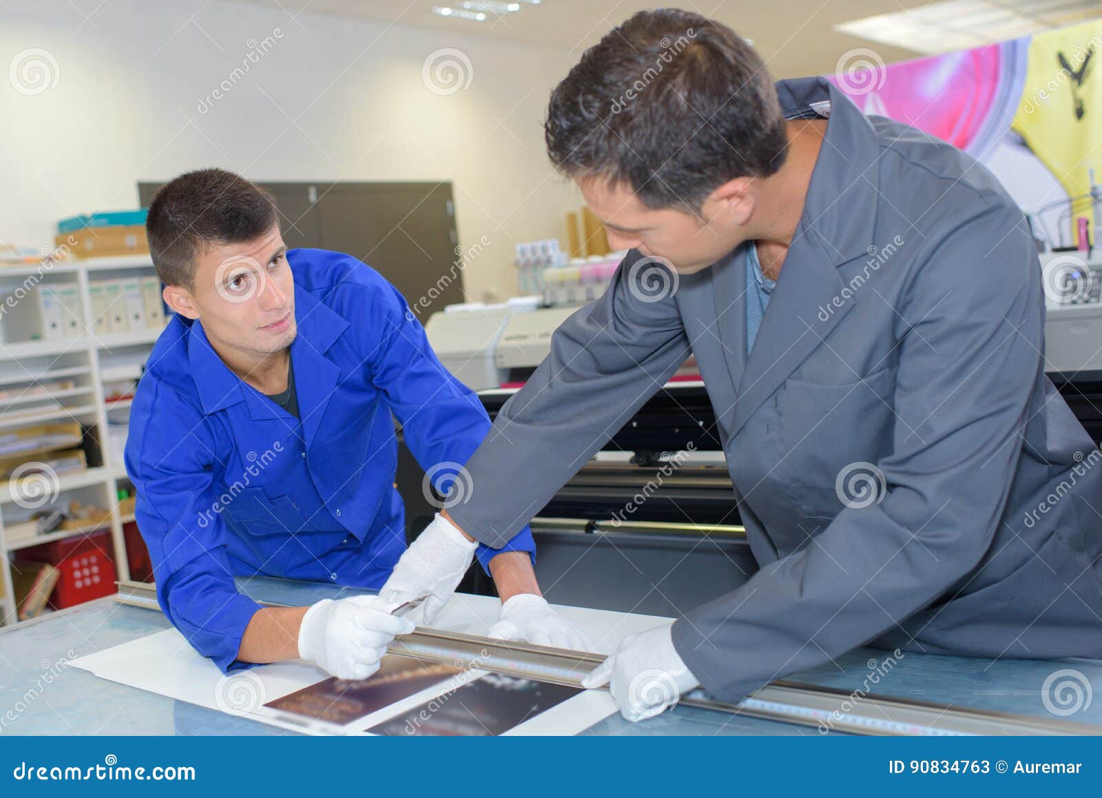 Two men creating poster stock image. Image of printers - 90834763