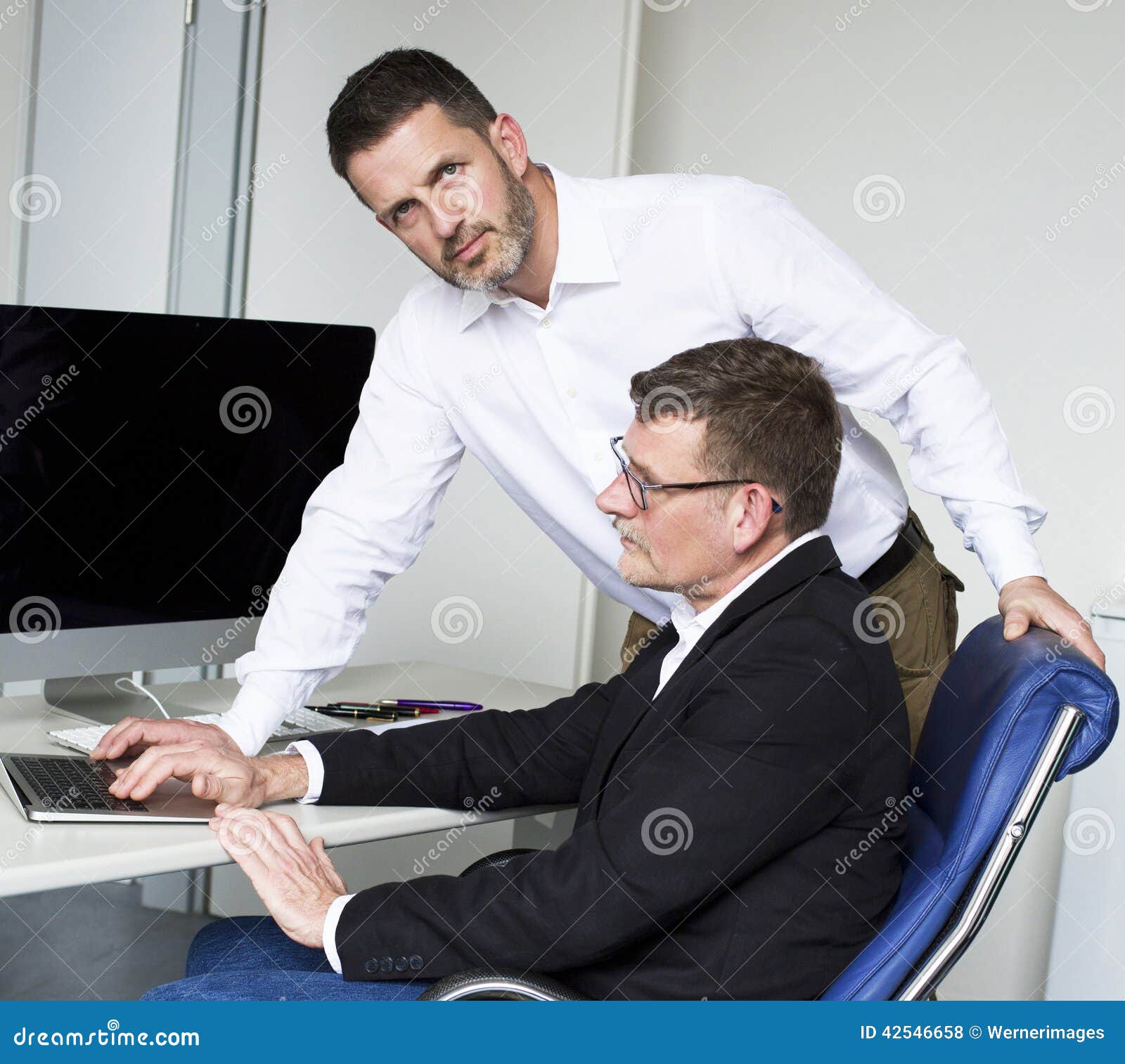 Two men at desk stock photo. Image of planning, meeting - 42546658