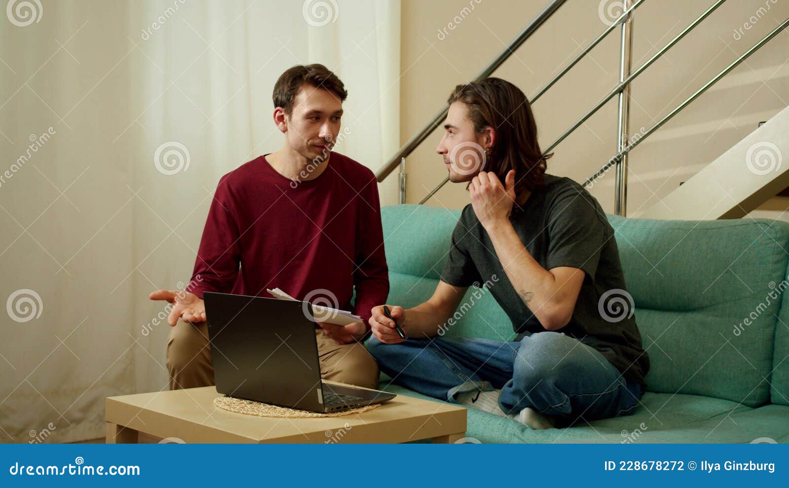 Two Men are Discussing and Looking through Documents Stock Photo ...