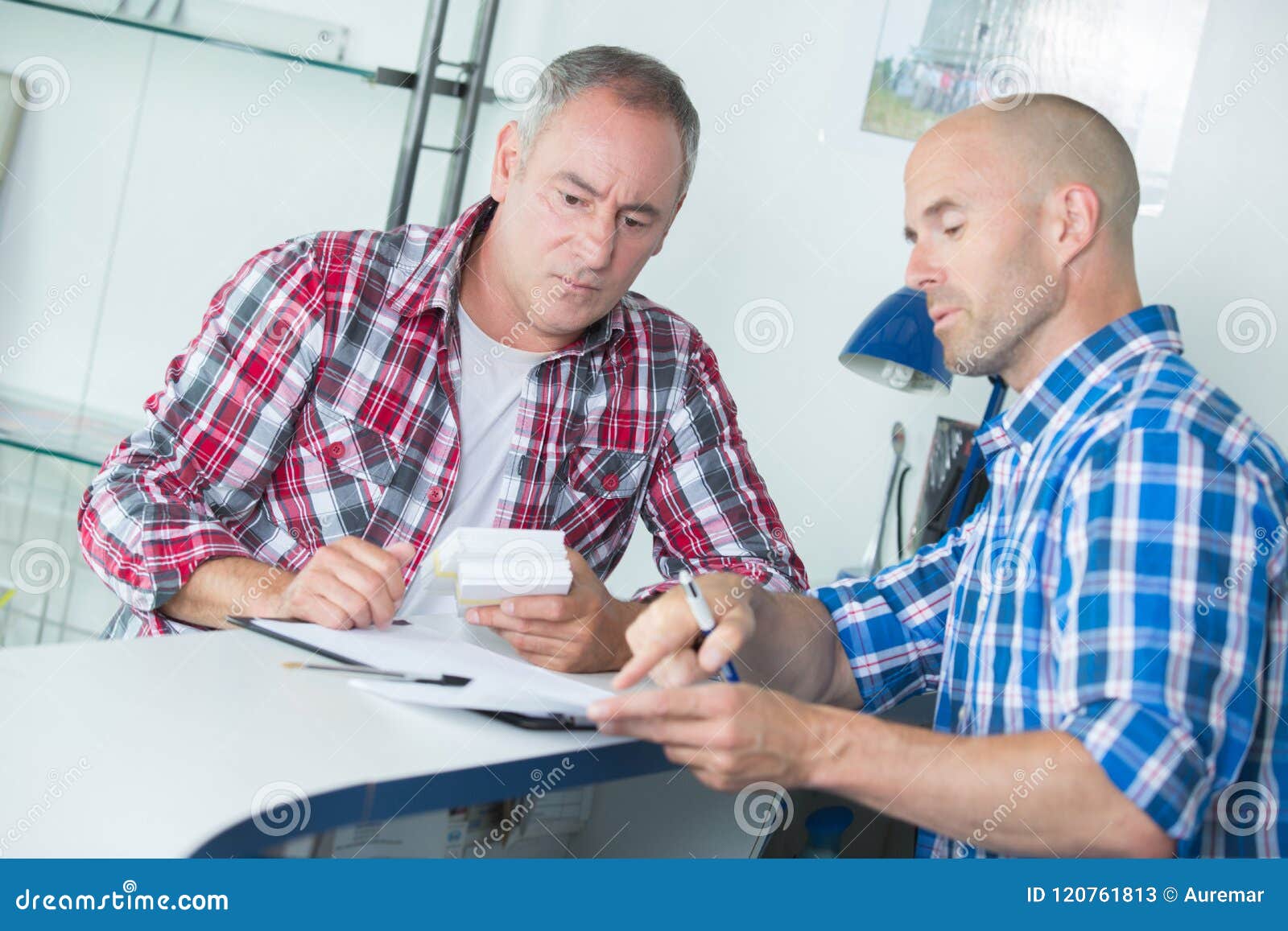 Two men discussing quote stock image. Image of value - 120761813