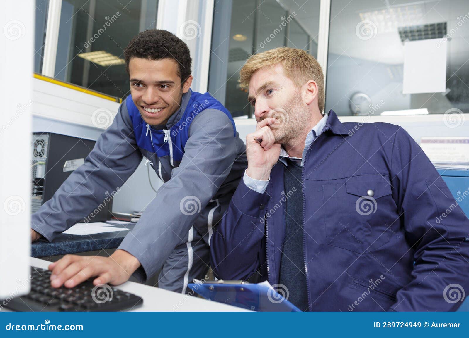 Two men discussing work stock image. Image of reading - 289724949