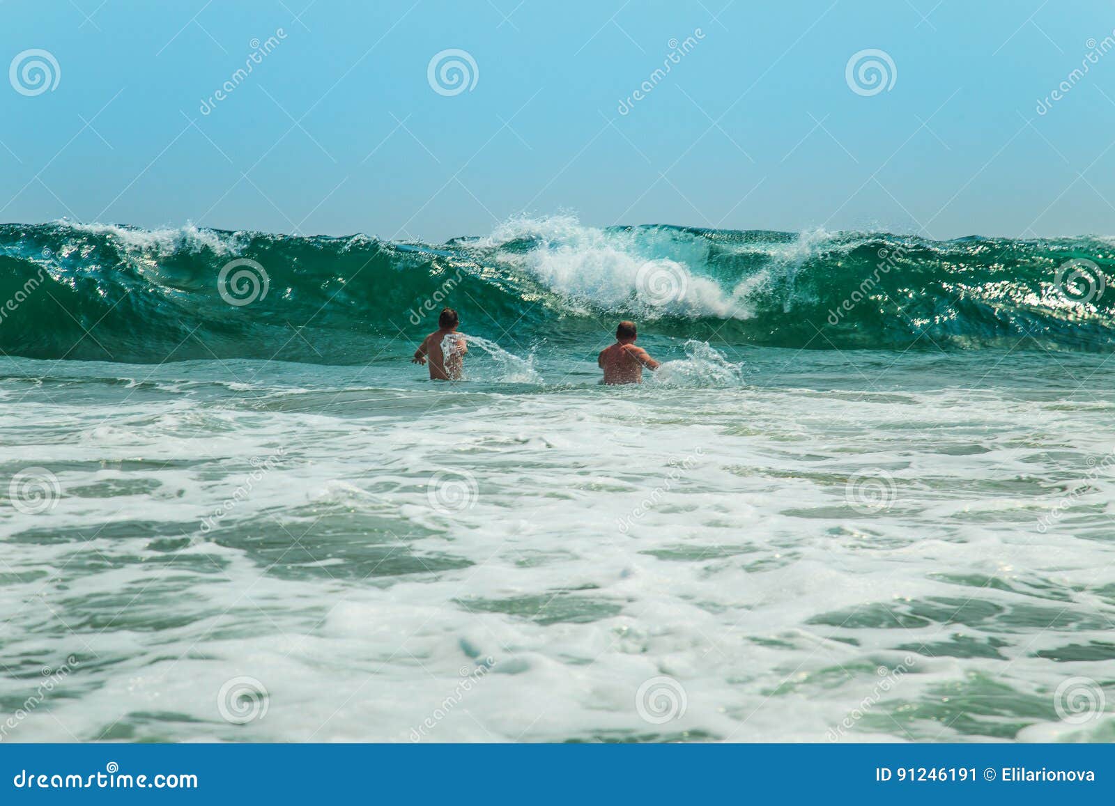 Two Men Dive into the Waves. Stock Image - Image of beautiful, dive ...