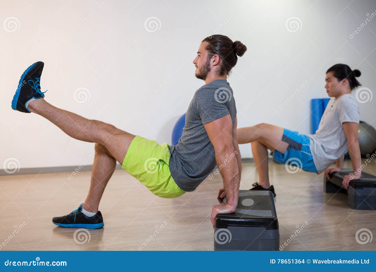 Two Men Doing Aerobic Exercise on Stepper Stock Photo - Image of ...