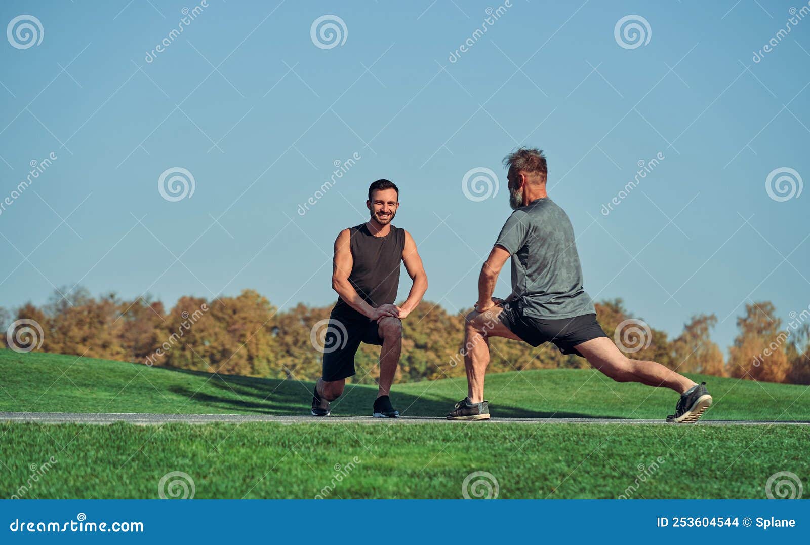 The Two Men Doing Exercise Outdoor. Stock Photo - Image of nature ...
