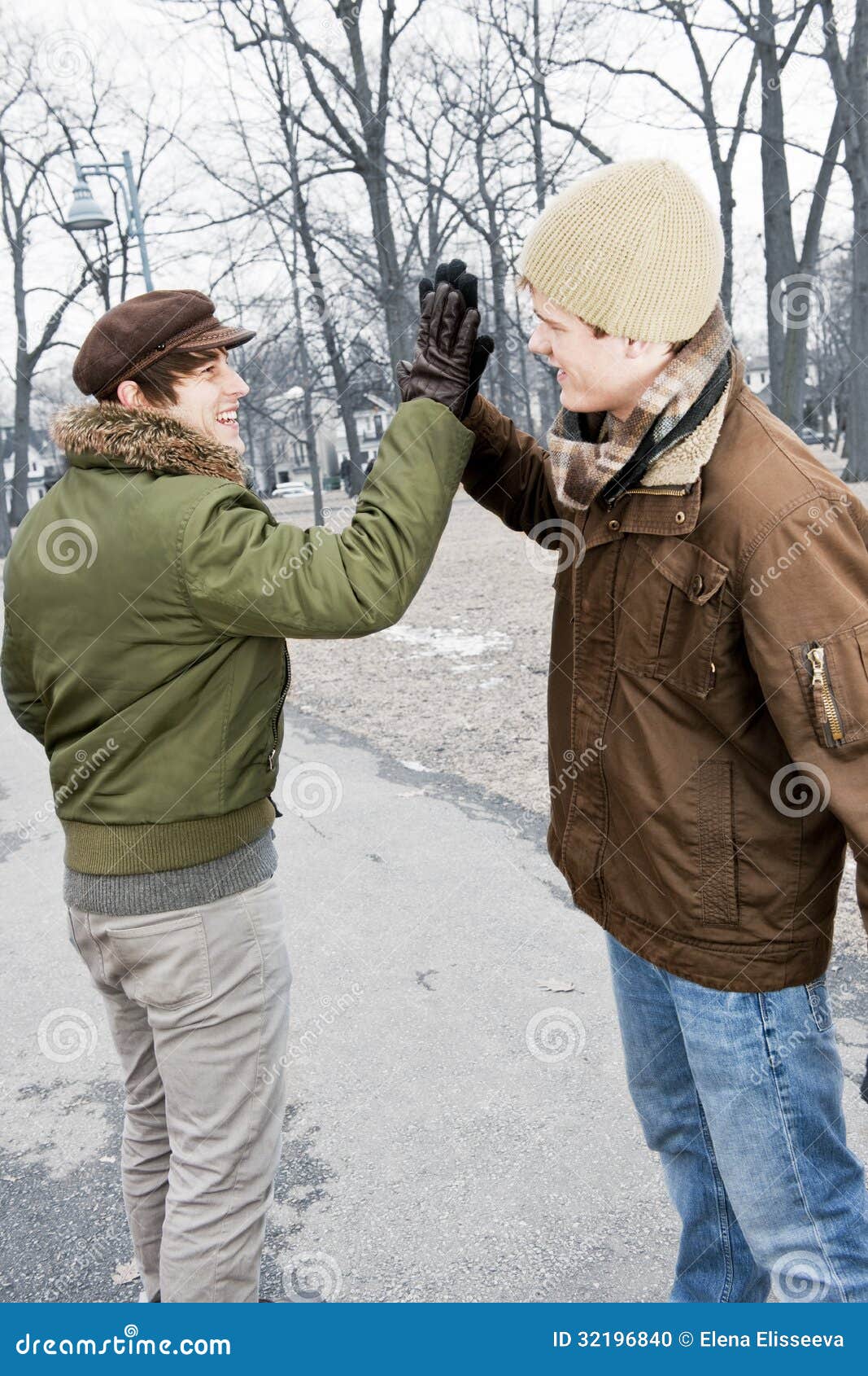 Two Men Doing High Five in Park Stock Photo - Image of five, friendship ...