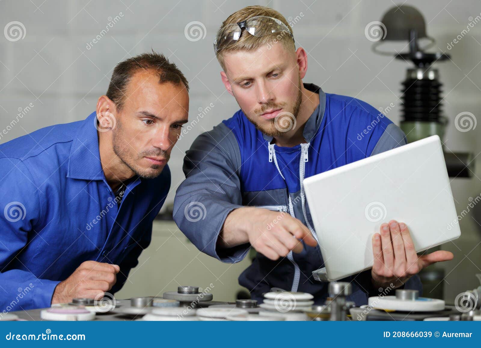Two Men Doing Induction Hardening in Factory Stock Image - Image of ...