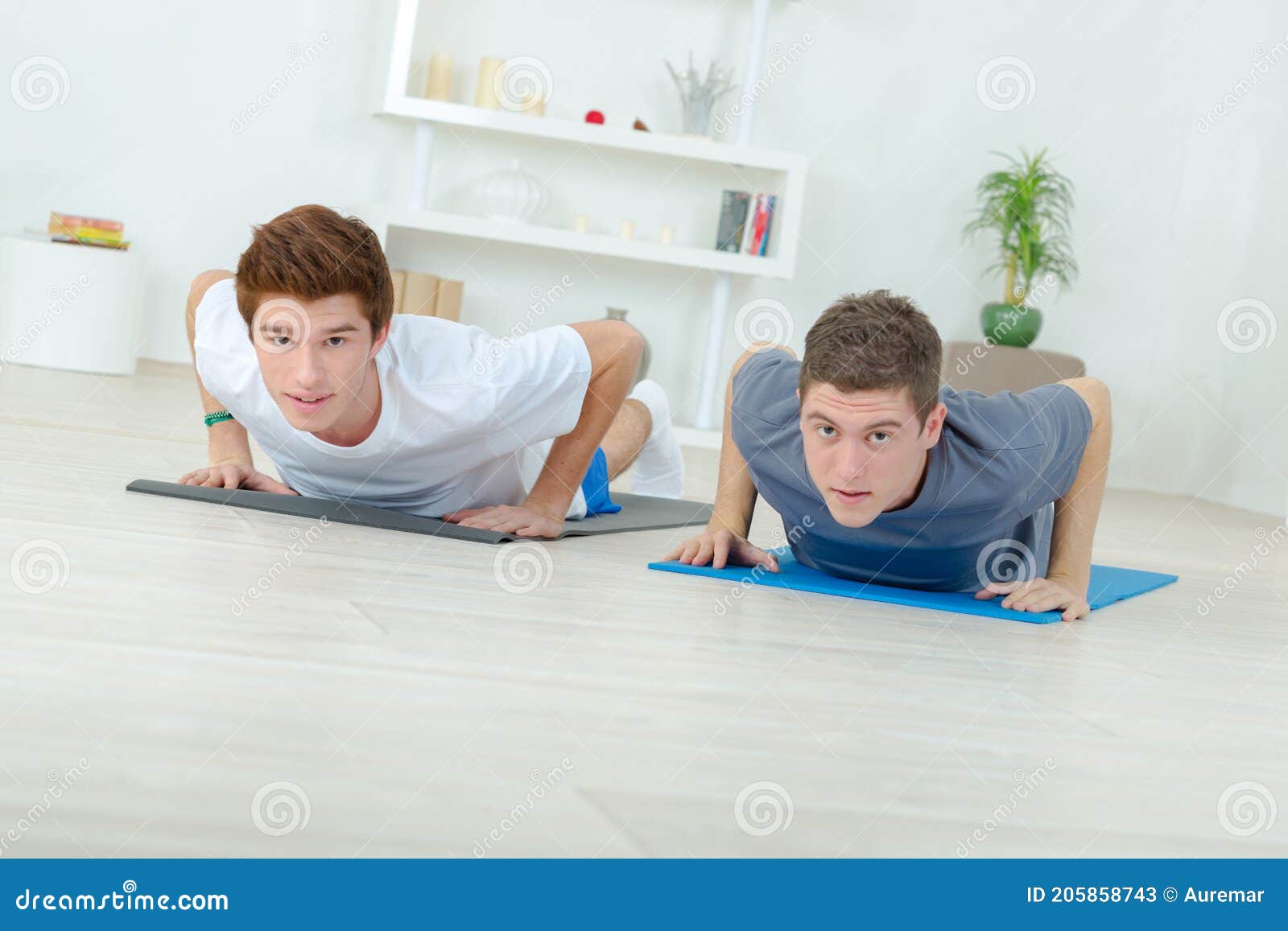 Two men doing push-ups stock image. Image of healthy - 205858743