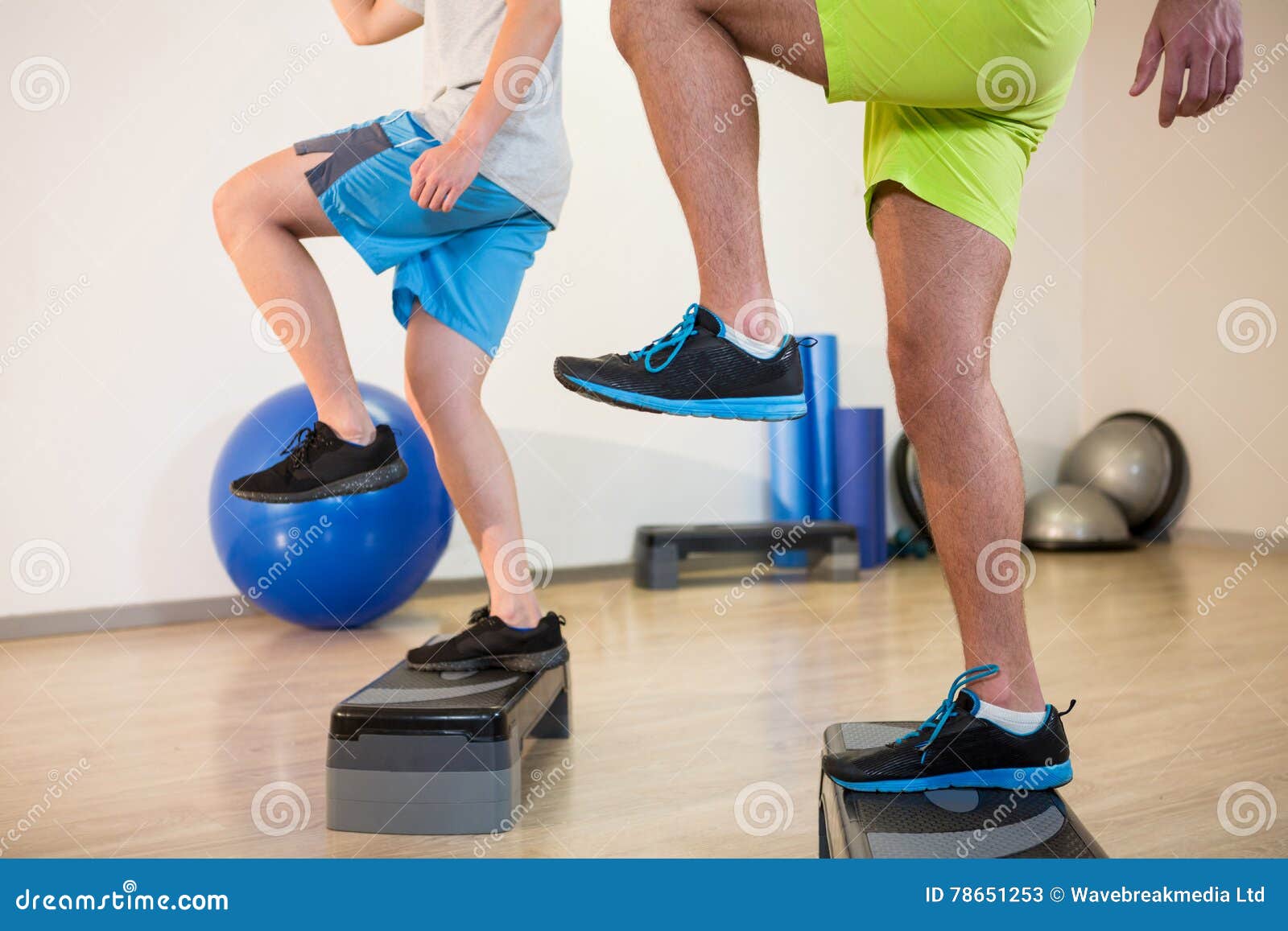 Two Men Doing Step Aerobic Exercise on Stepper Stock Image - Image of ...