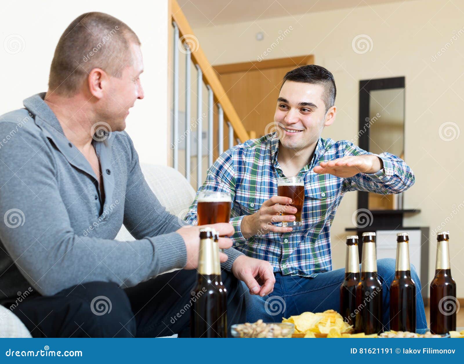 Two men drinking beer stock image. Image of happiness - 81621191