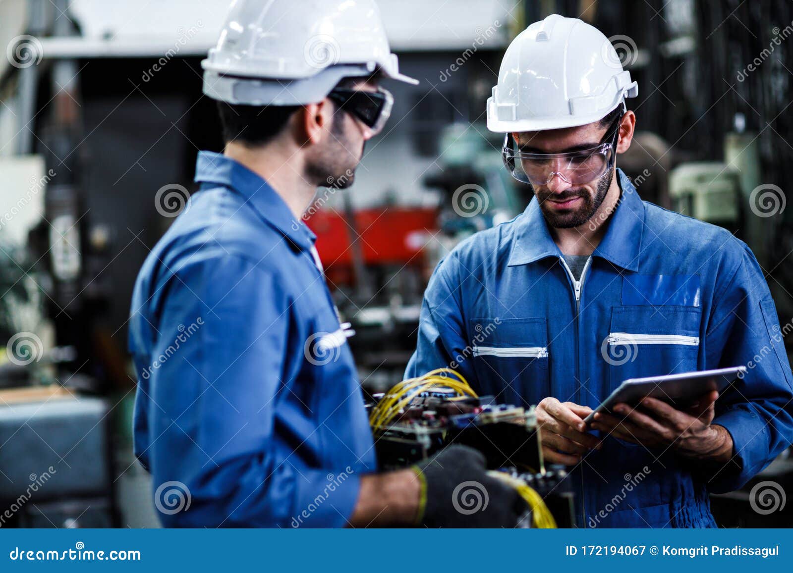 Two Men Engineer Talking in Modern Factory. Stock Image - Image of ...