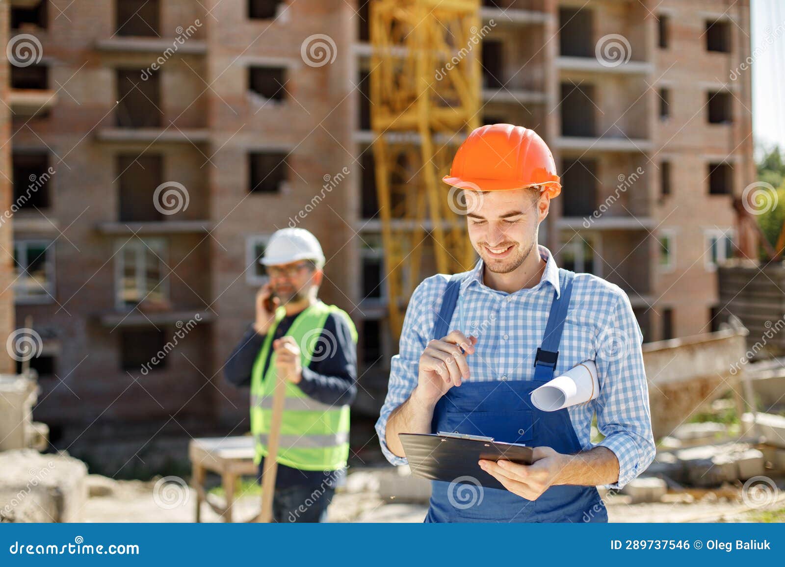 Two Men Engineers at a Construction Site Doing Their Job Stock Photo ...