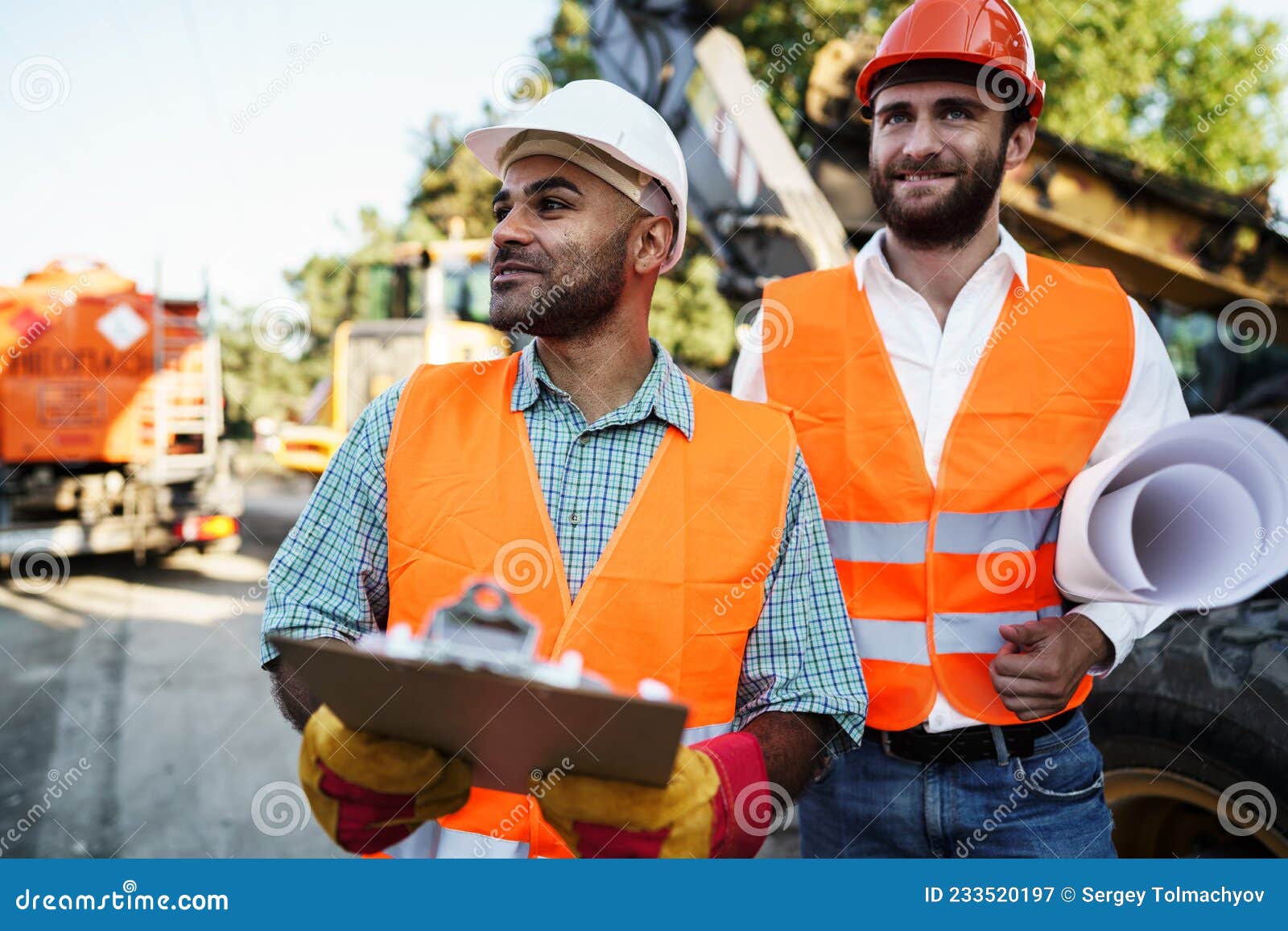 Two Men Engineers Discussing Their Work Standing Against Construction ...
