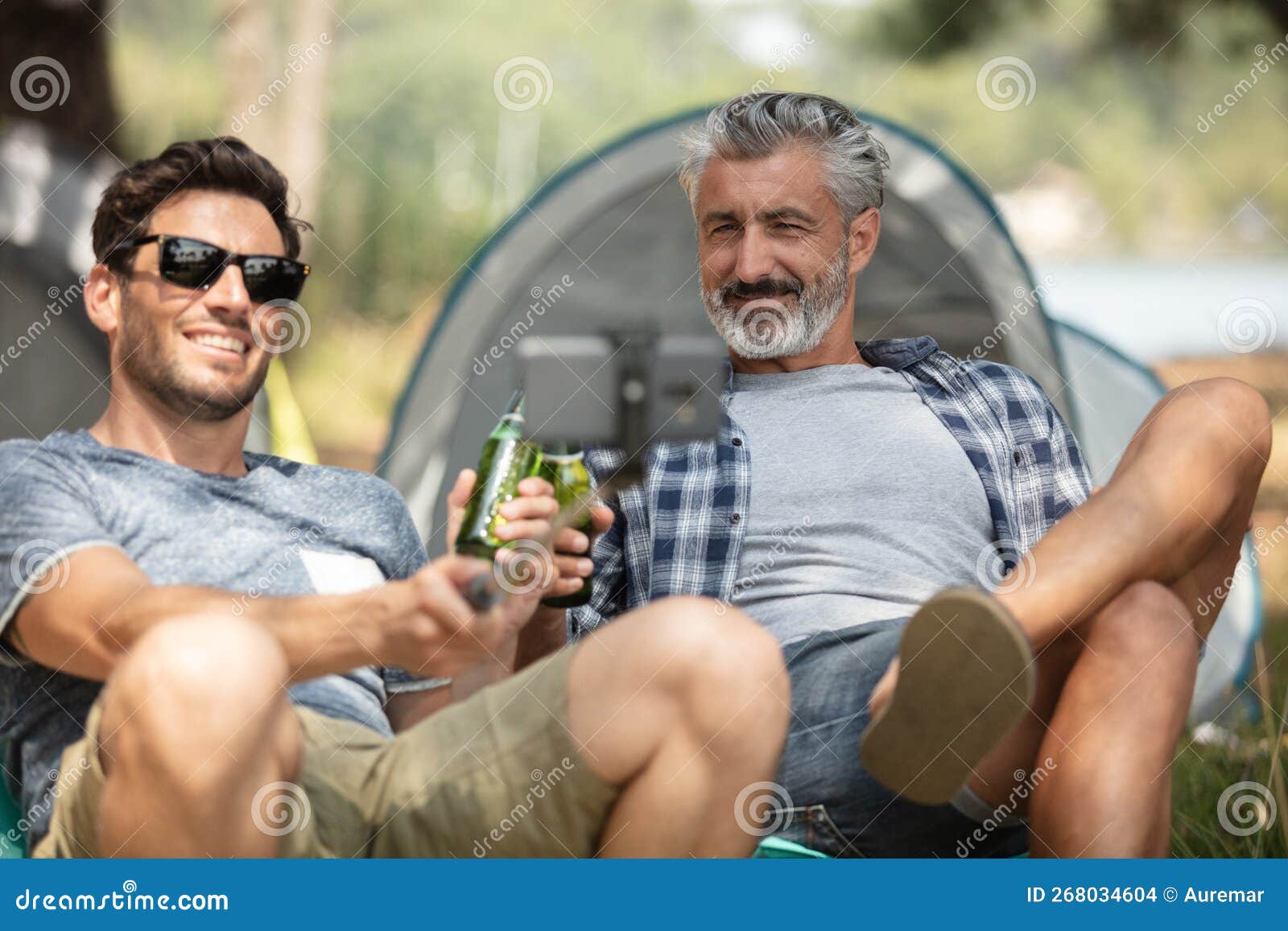 Two Men Enjoying Beer at Campsite Stock Photo - Image of moment ...