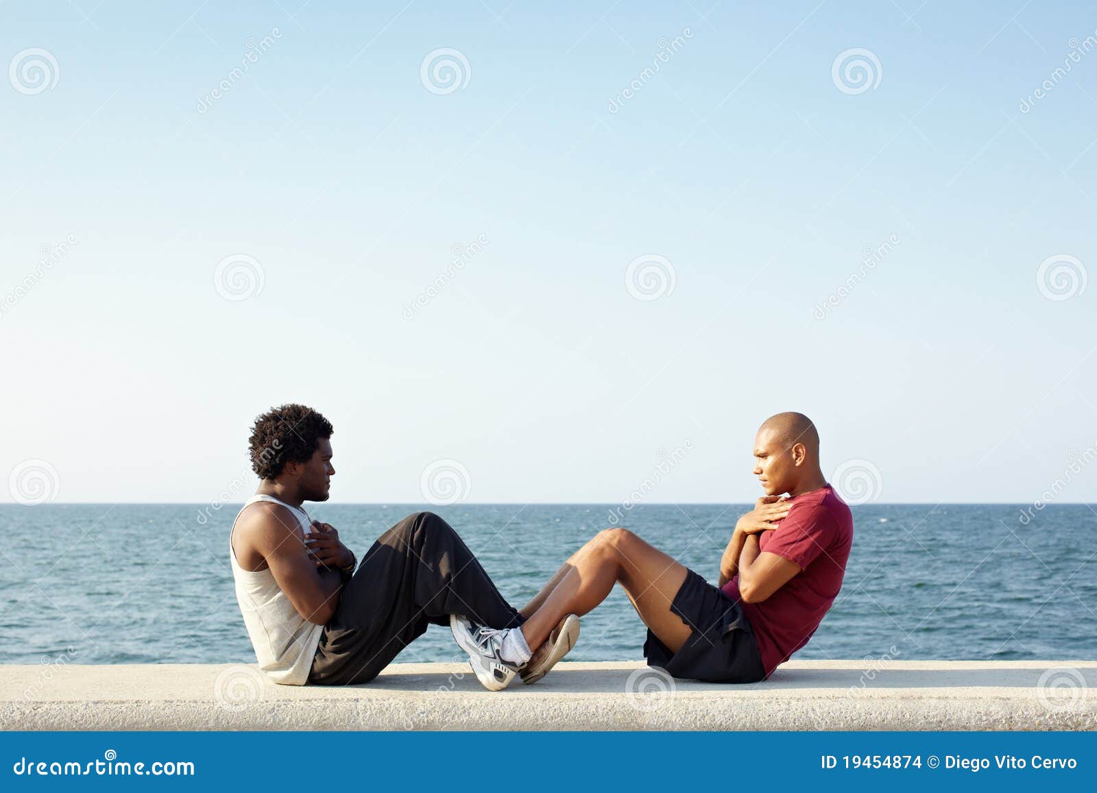 Two Men Exercising Abs Near the Sea Stock Photo - Image of ocean ...
