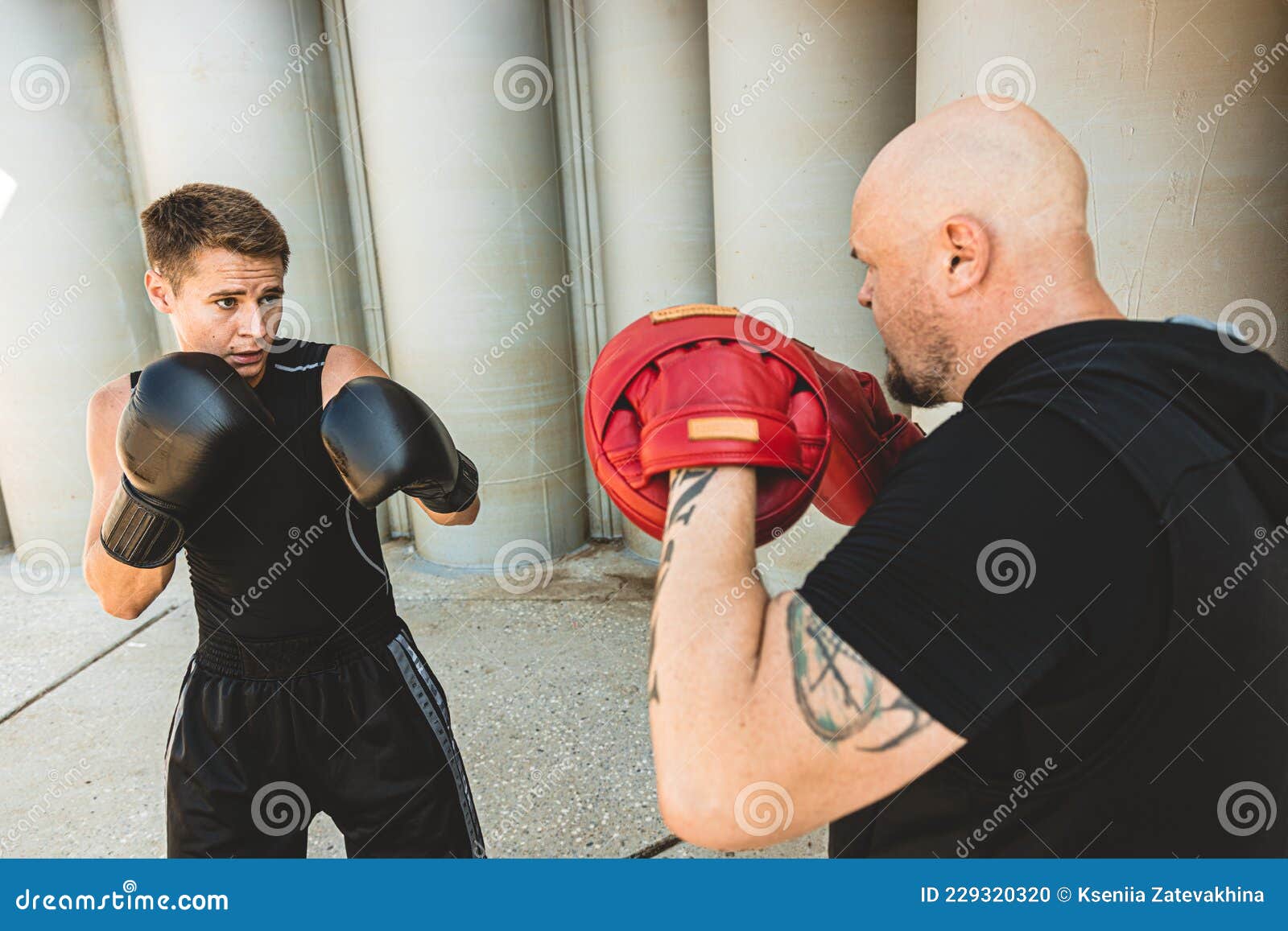 Two Men Exercising and Fighting in Outside. Boxer in Gloves is Training ...