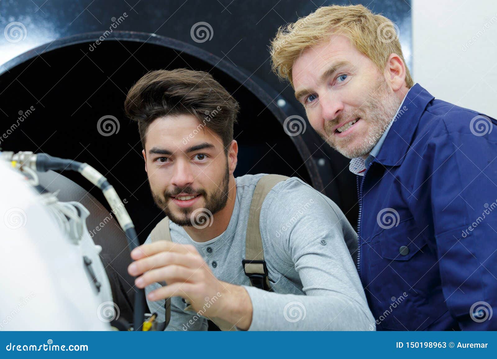 Two Men in Factory Operating Modern Machines Stock Image - Image of ...