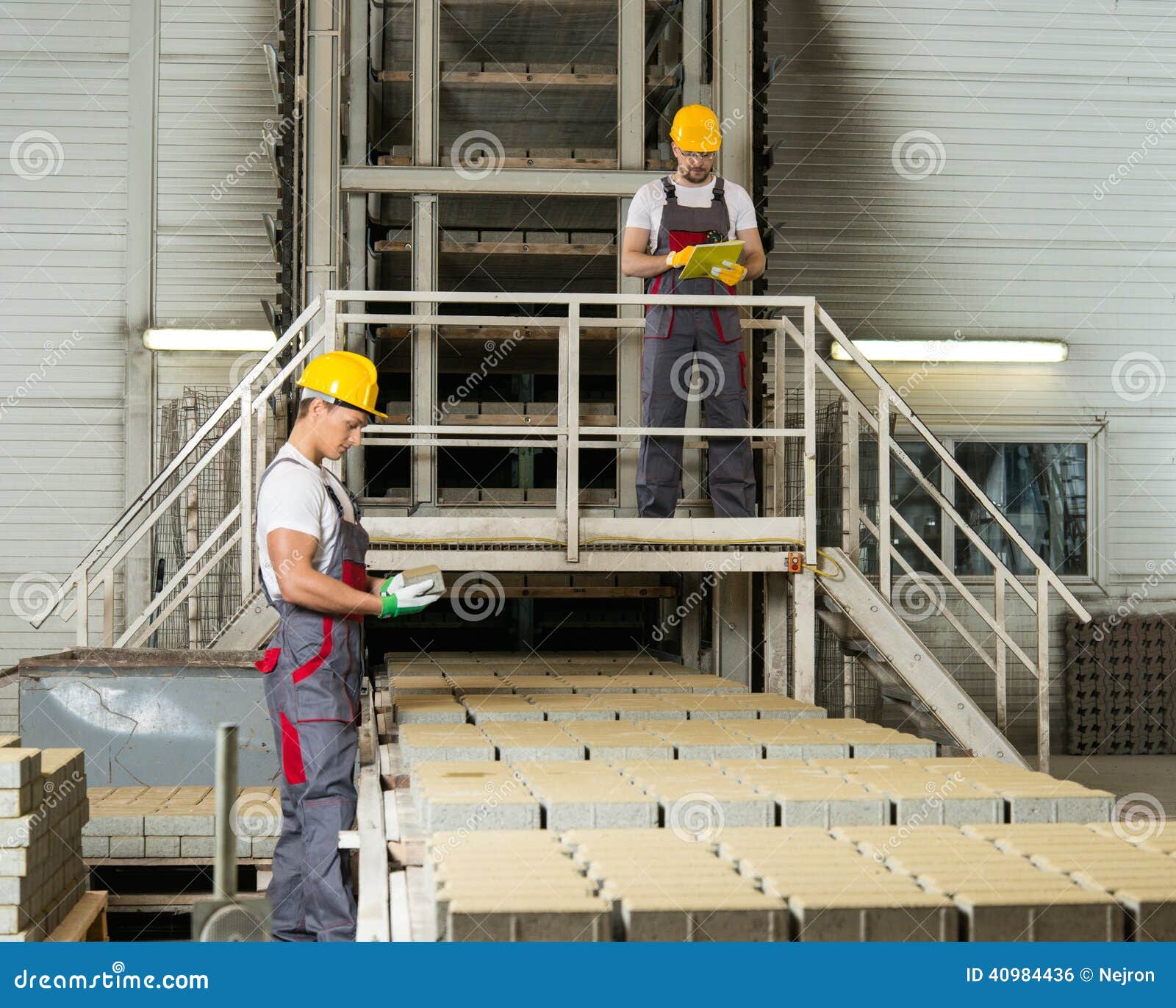 Two men on a factory stock photo. Image of kerbstone - 40984436
