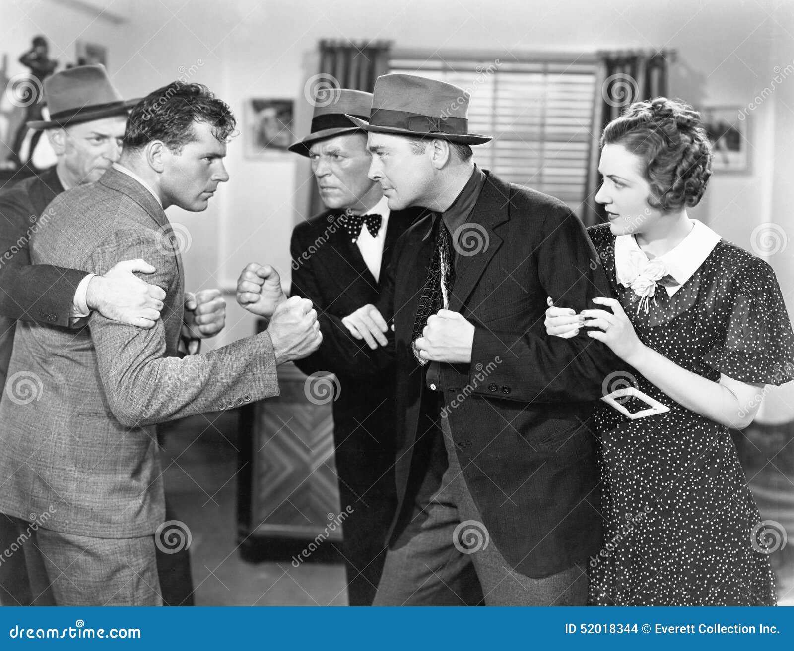 Two Men Fighting with Each Other and Being Held Back by a Woman and a ...
