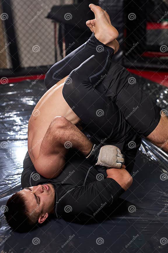 Two Men Fighting on Mat Using Grappling, Fight without Rules Stock ...