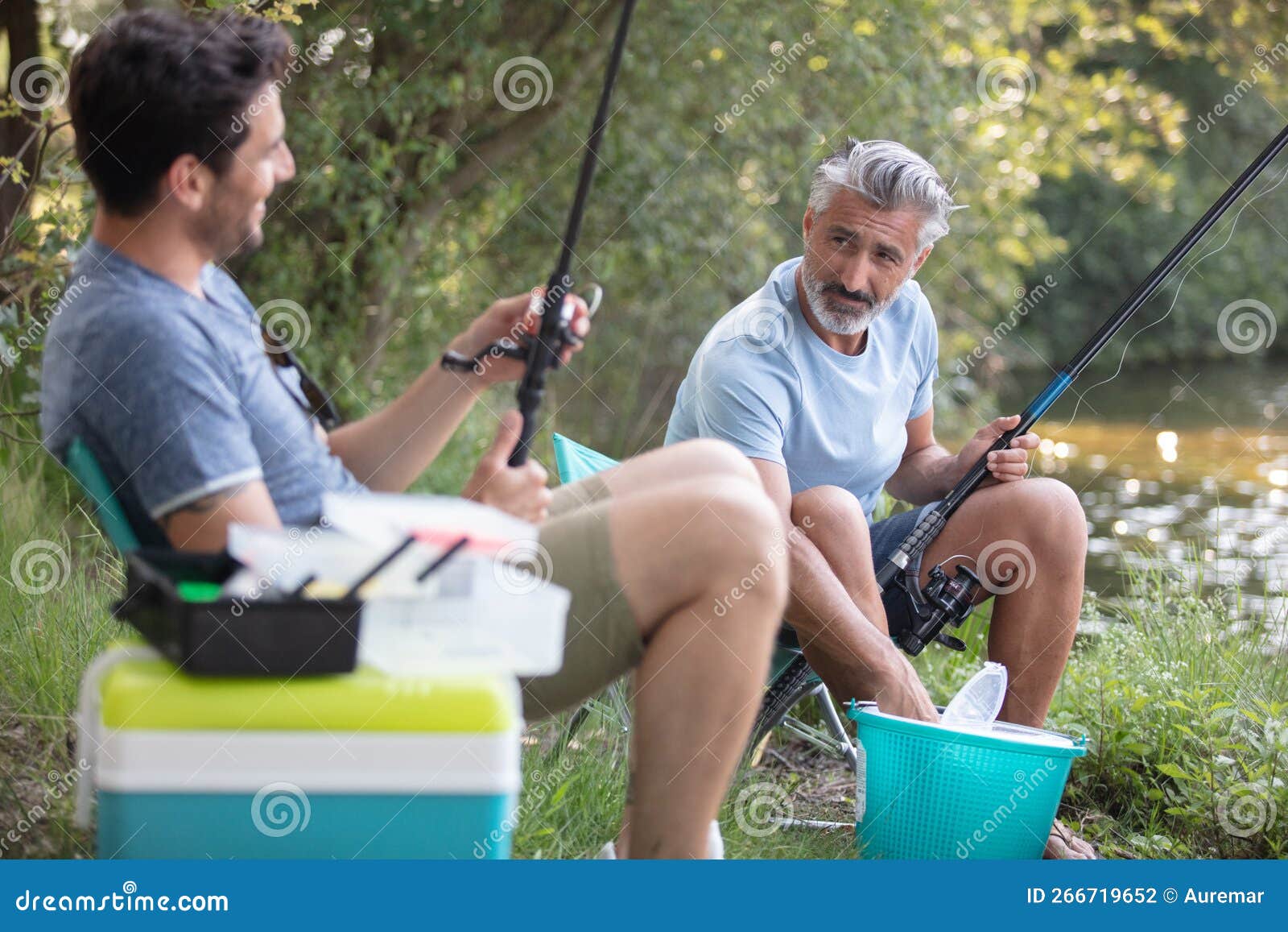 Two Men Fishing from Pier on River Stock Photo - Image of fish, sitting ...