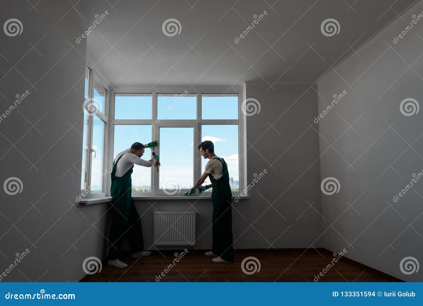 Two men are fixing window stock photo. Image of plastic - 133351594