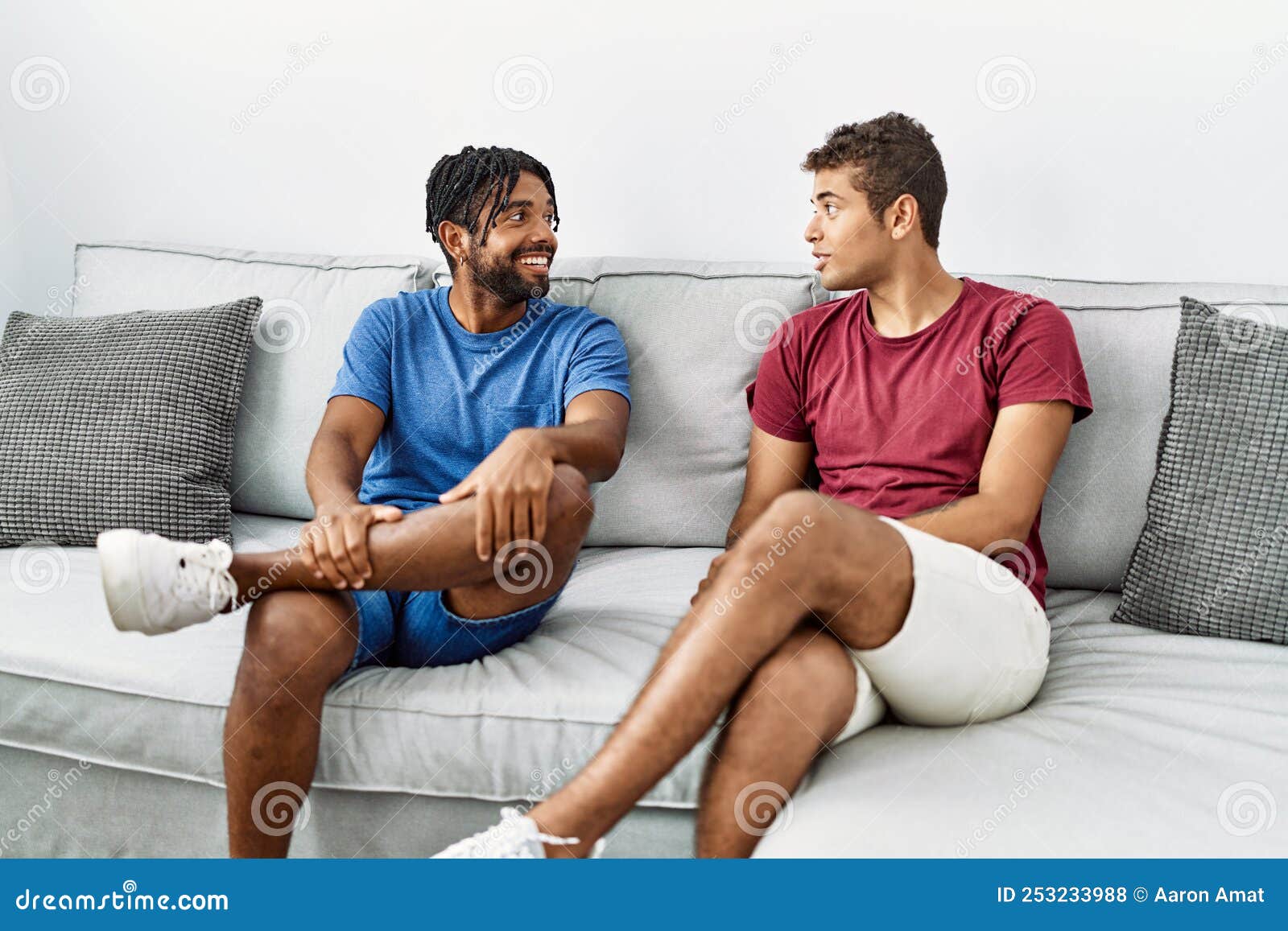 Two Men Friends Having Conversation Sitting on Sofa at Home Stock Photo ...