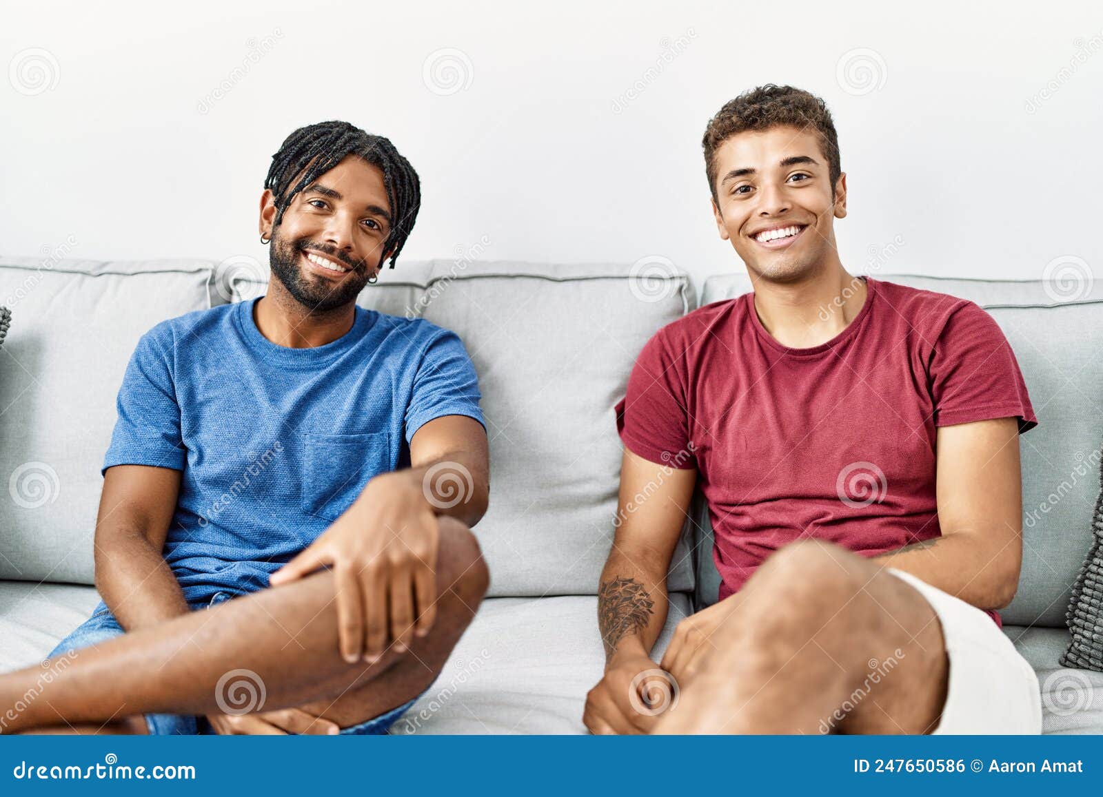 Two Men Friends Smiling Confident Sitting on Sofa at Home Stock Photo ...