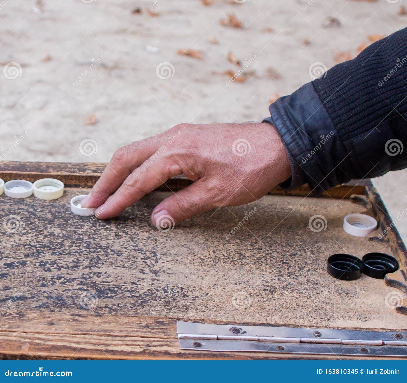 Two Men Gamble in the Street Playing Backgammon in the Fall Stock Image ...