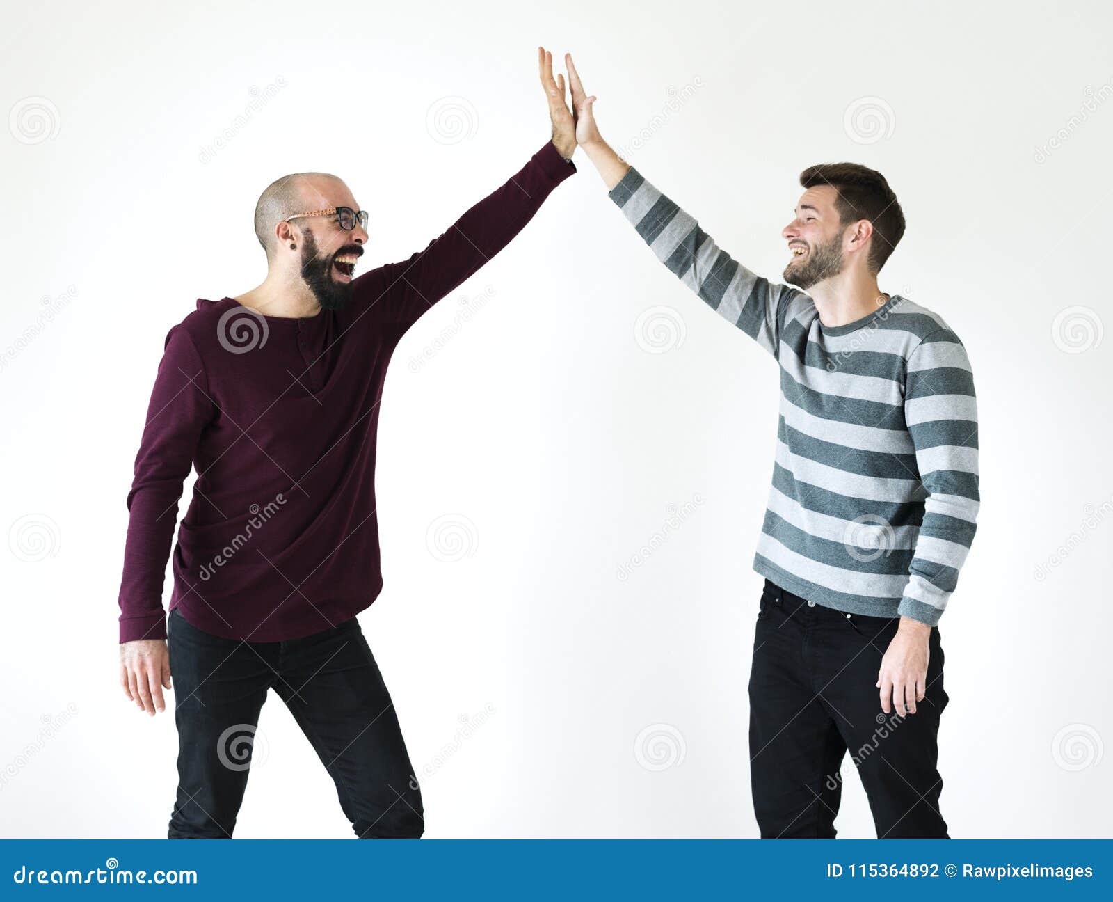 Two men giving a high five stock photo. Image of achievement - 115364892