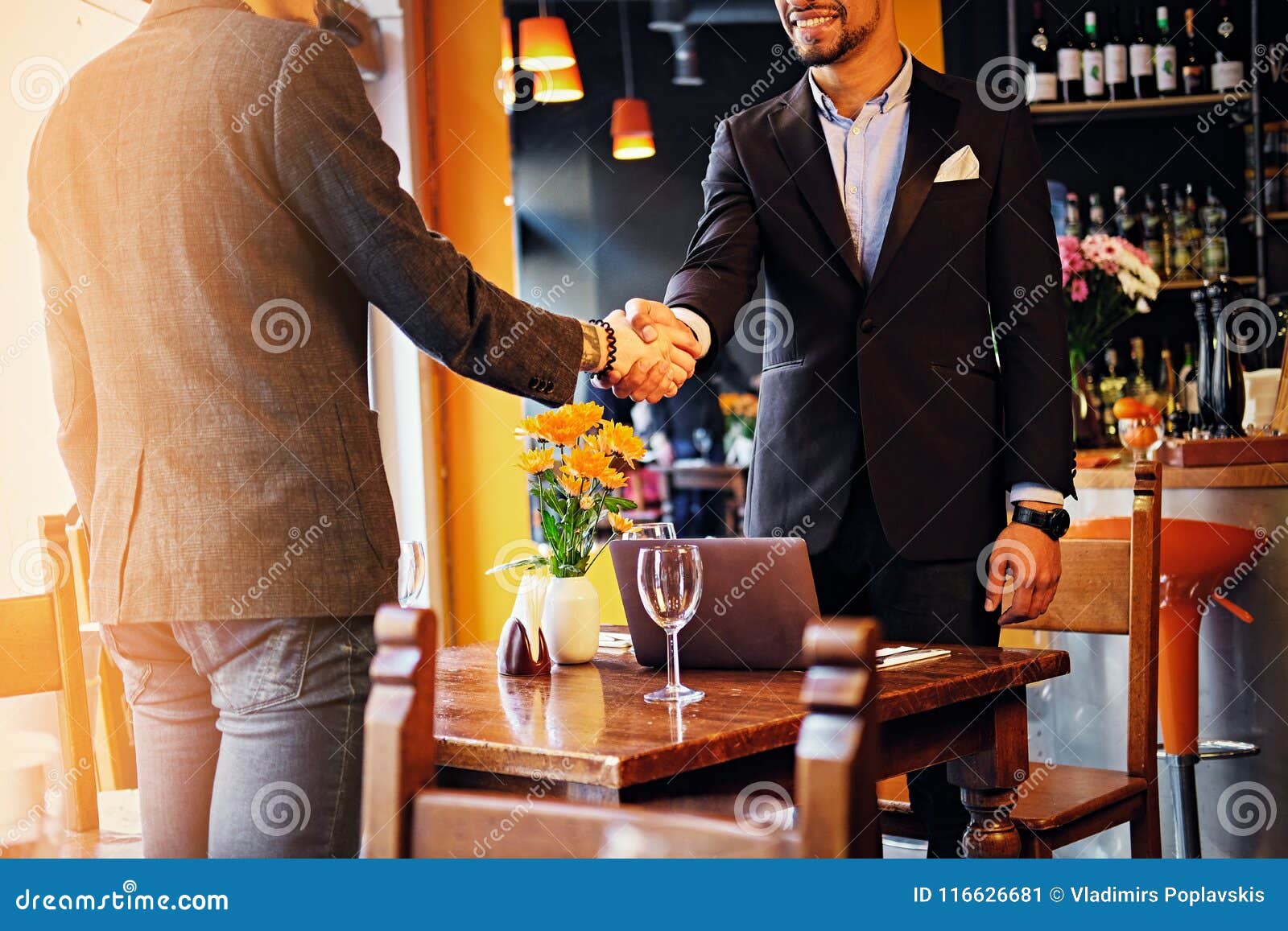 Two Men Handshake in a Restaurant. Stock Image - Image of american ...