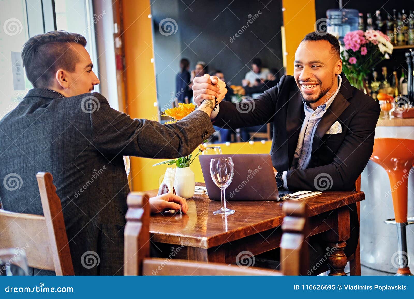 Two Men Handshake in a Restaurant. Stock Image - Image of caucasian ...