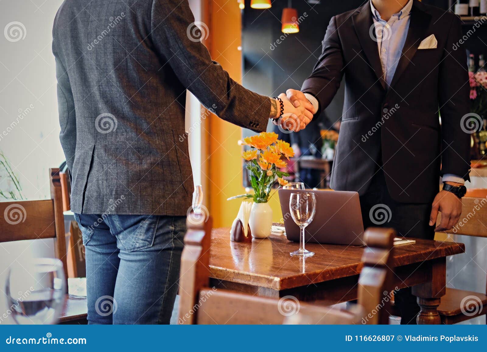 Two Men Handshake in a Restaurant. Stock Image - Image of people, adult ...