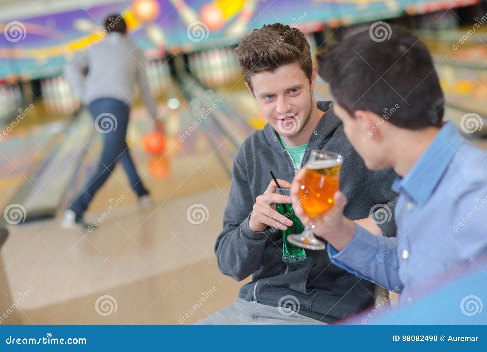 Two Men Having Drink at Bowling Alley Stock Photo - Image of straw ...
