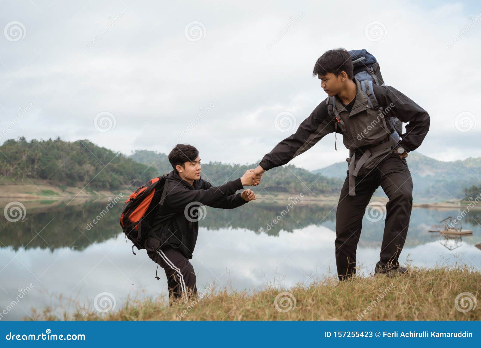 Two men hiking in mountain stock image. Image of backpacker - 157255423