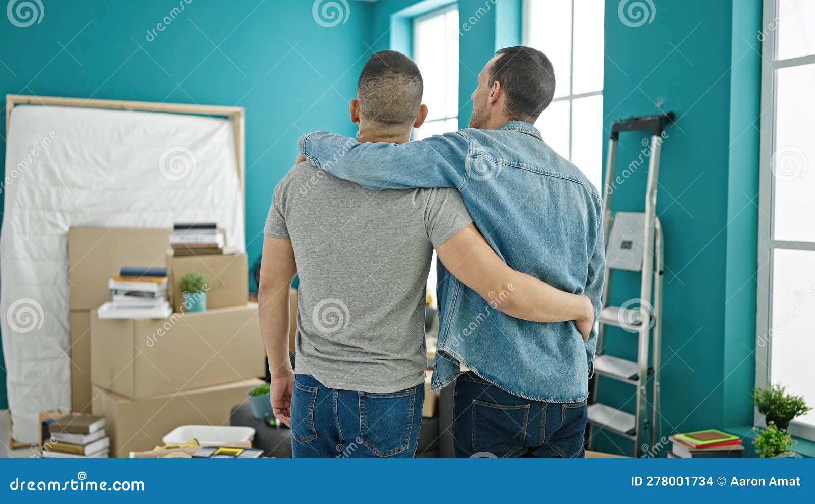 Two Men Hugging Each Other Standing Backwards at New Home Stock Photo ...