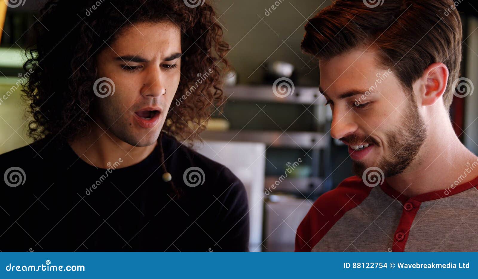 Two Men Interacting with Each Other while Using Digital Tablet Stock ...