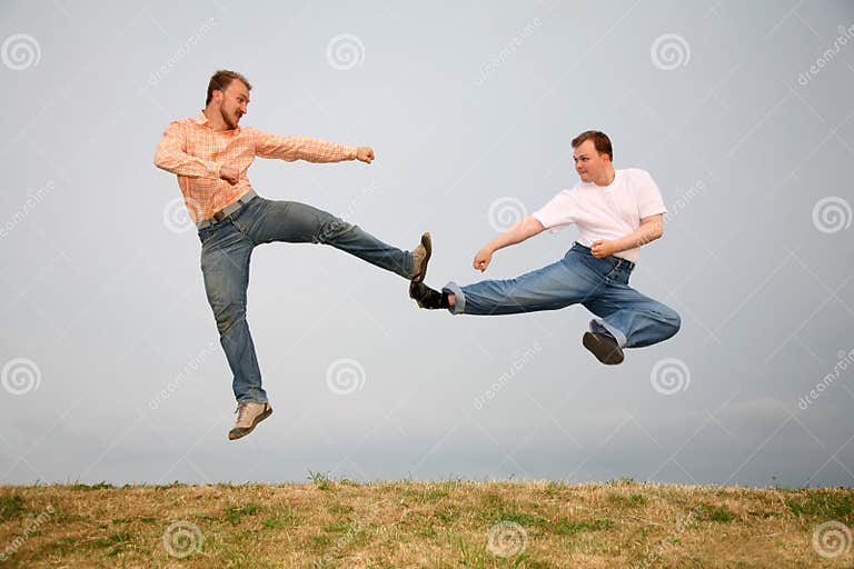 Two men kicking stock image. Image of jump, excitement - 2793737