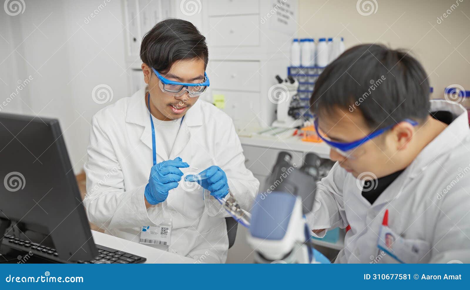 Two Men in a Laboratory Working Together on a Scientific Experiment ...