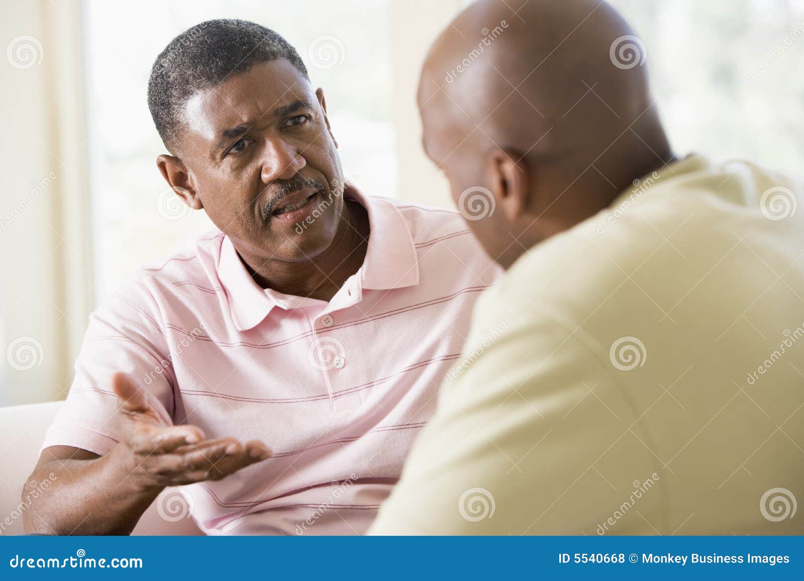 Two Men in Living Room Talking Stock Photo - Image of arguing, room ...